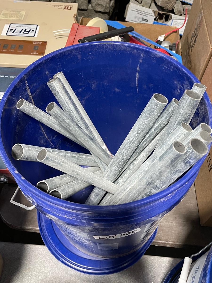 Bucket of Galvanized conduit/pipe pieces | EstateSales.org
