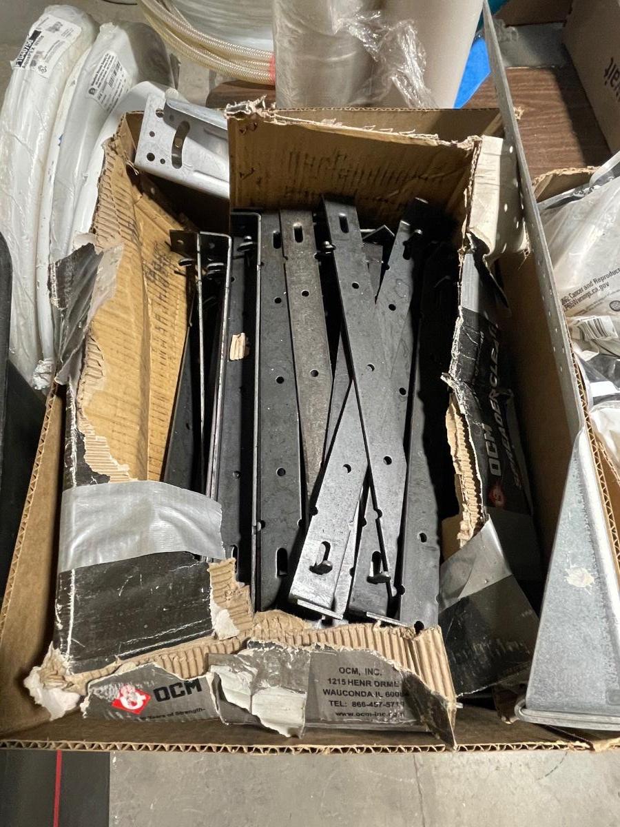 Box of New Metal Spreader Cleats | EstateSales.org