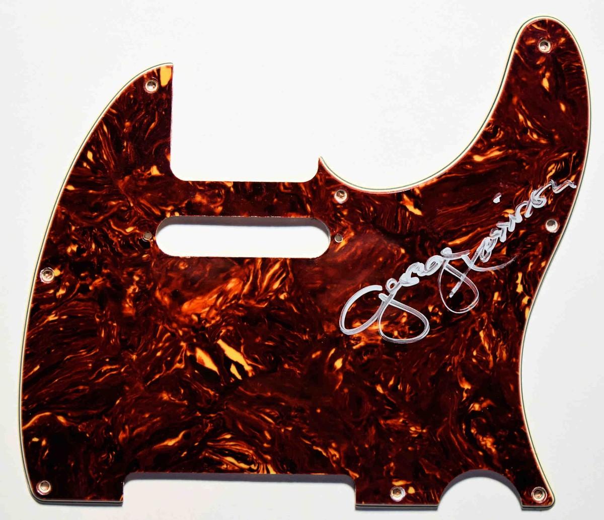 George Harrison signed pickguard | EstateSales.org