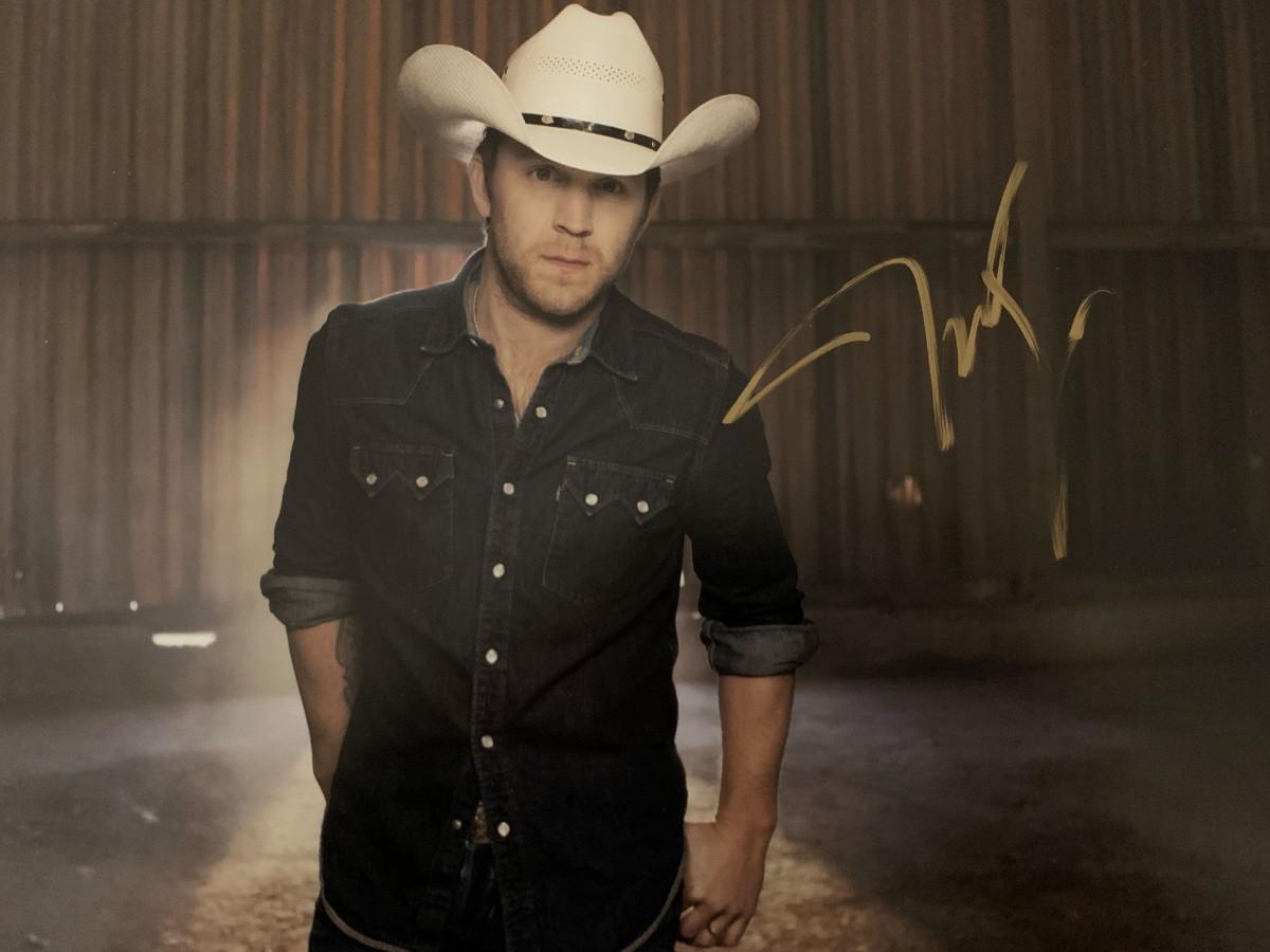 Justin Moore signed photo | EstateSales.org