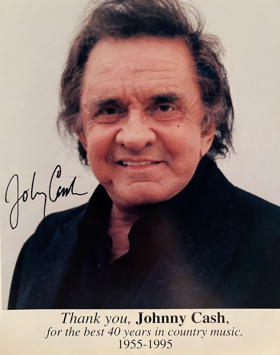 Johnny Cash facsimile signed photo. 8x10 inches | EstateSales.org