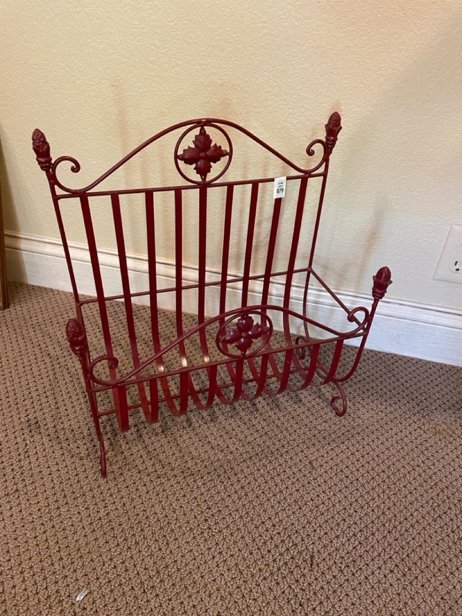 Red metal magazine rack | EstateSales.org