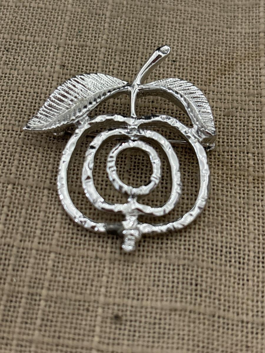 Silver tone Sarah Cov apple pin | EstateSales.org