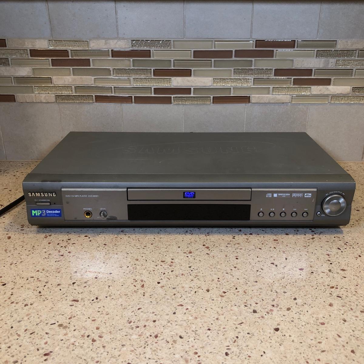 LOT 215L: Samsung DVD/CD/MP3 Player Model DVD-M301 | EstateSales.org