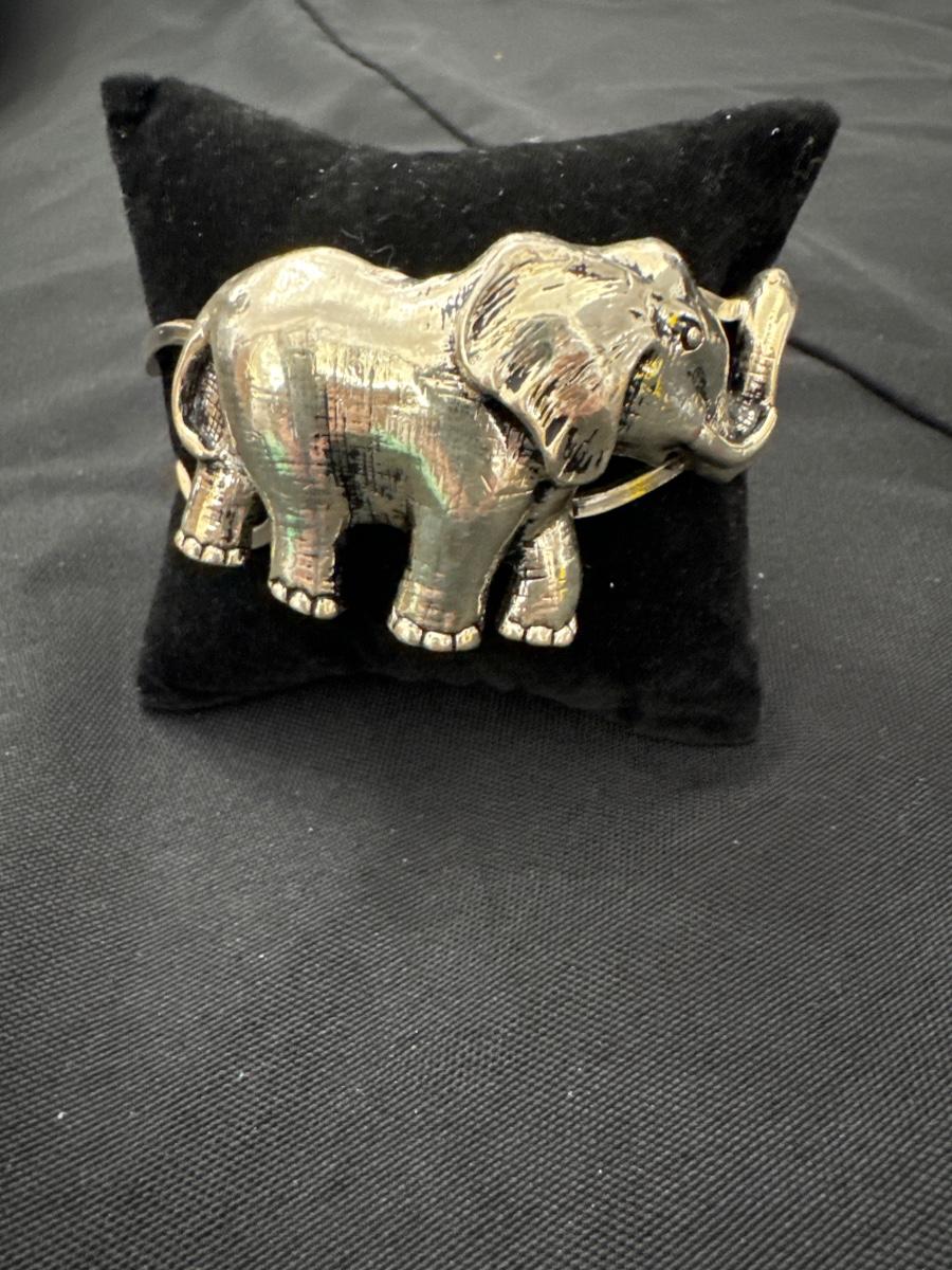 Lucky trunk up metal elephant, hinged bracelet | EstateSales.org