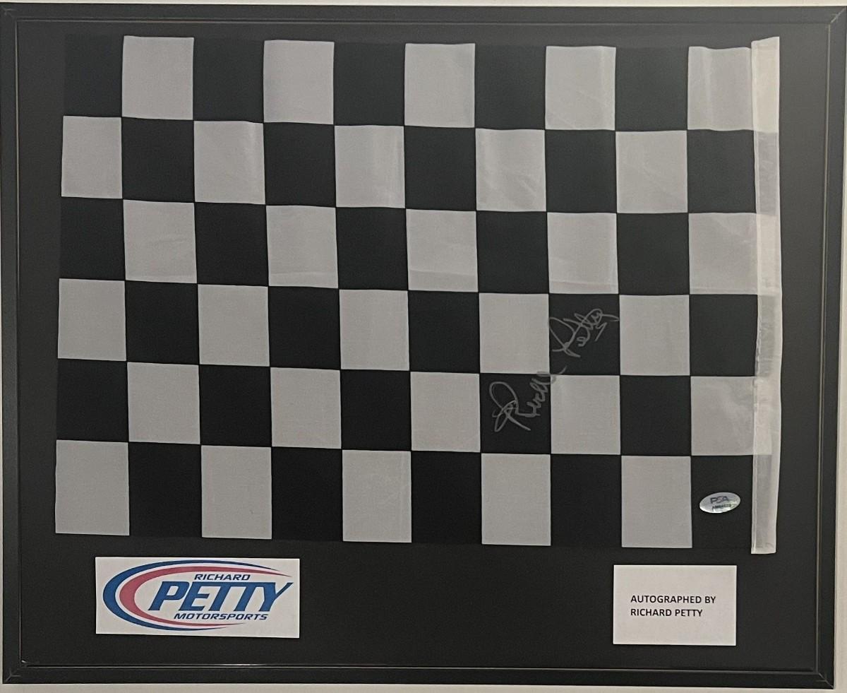 Richard Petty signed checkered flag. PSA authenticated | EstateSales.org