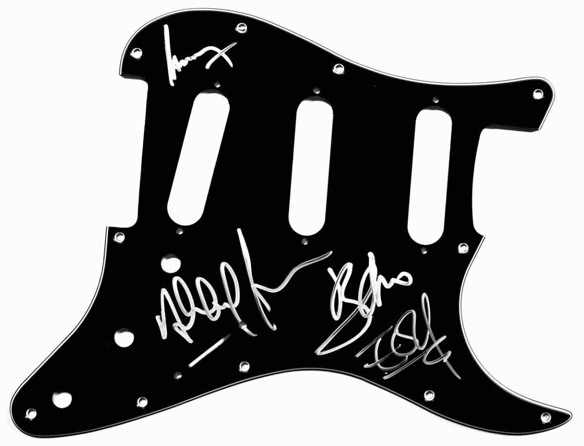 U2 signed pickguard | EstateSales.org