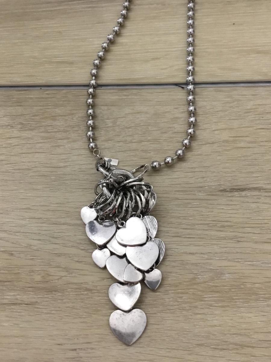 Silver tone marked heart dangle beaded necklace | EstateSales.org