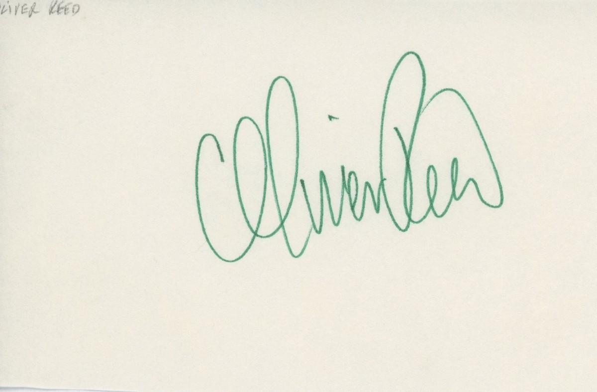 Oliver Reed signature cut | EstateSales.org