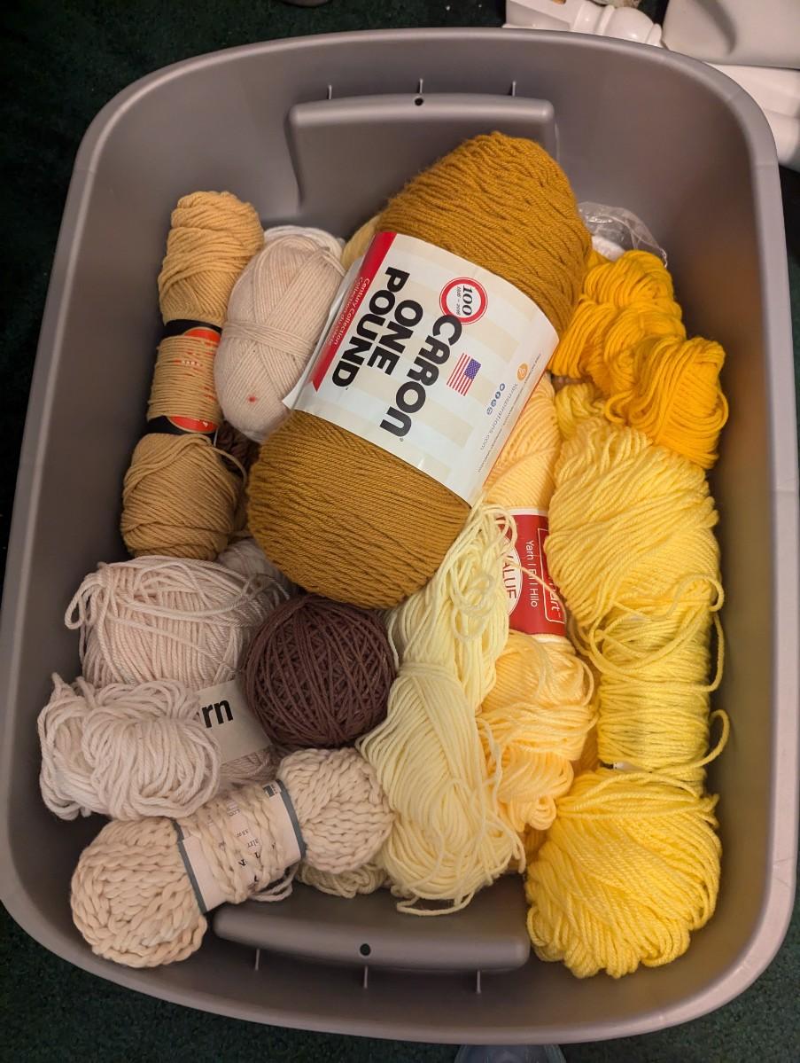 Bin Full Of Yarn Off White, Yellow, and Brown | EstateSales.org