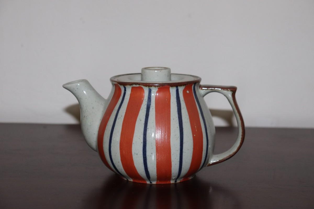 Orange and blue stripped tea pot | EstateSales.org