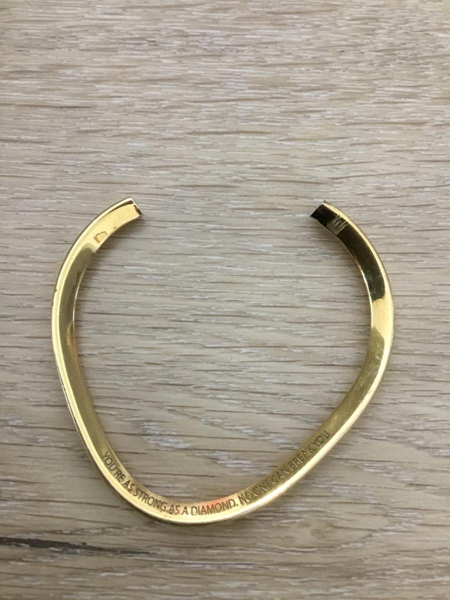 Gold tone LS marked bangle cuff bracelet | EstateSales.org