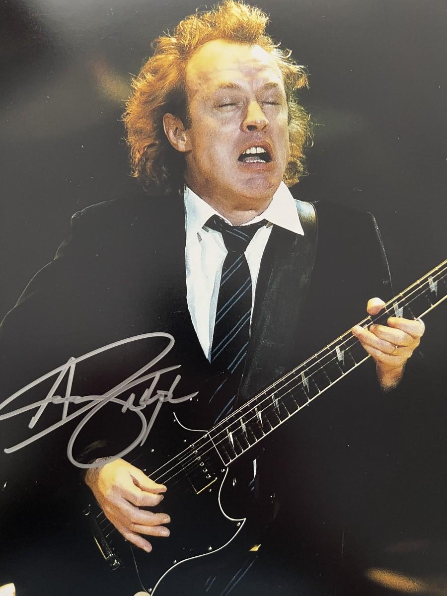 ACDC Angus Young signed photo | EstateSales.org