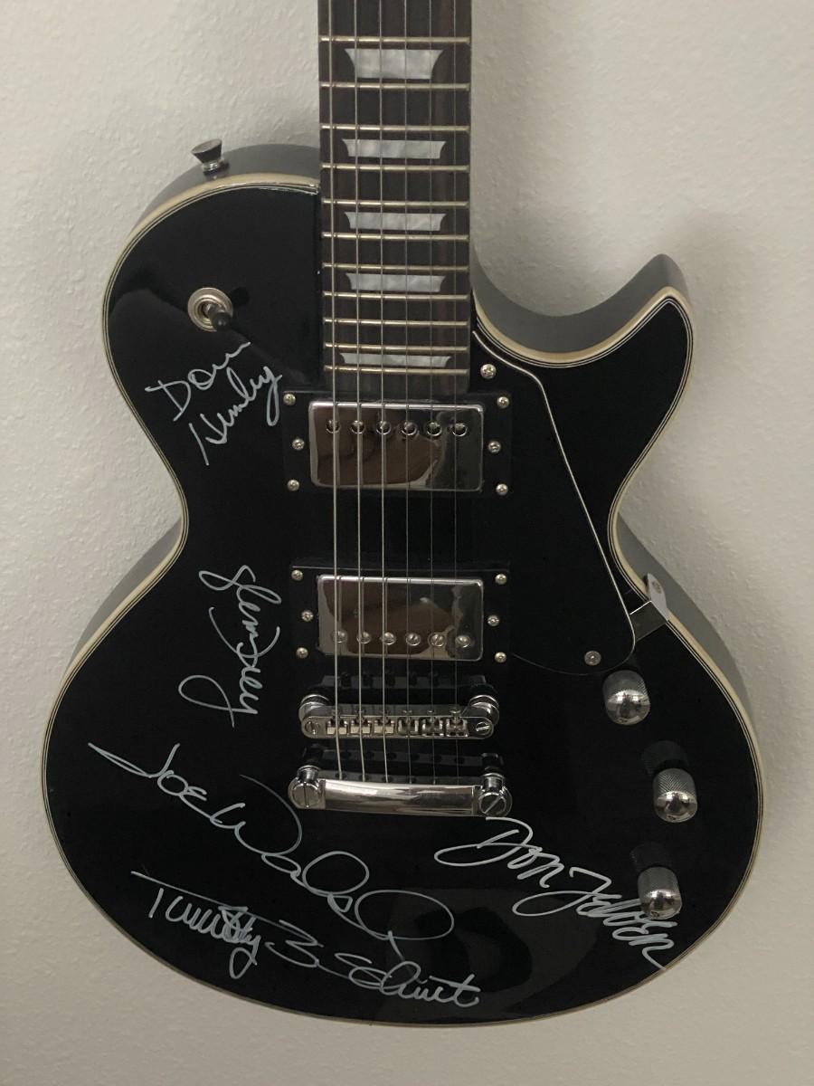 The Eagles band signed guitar | EstateSales.org