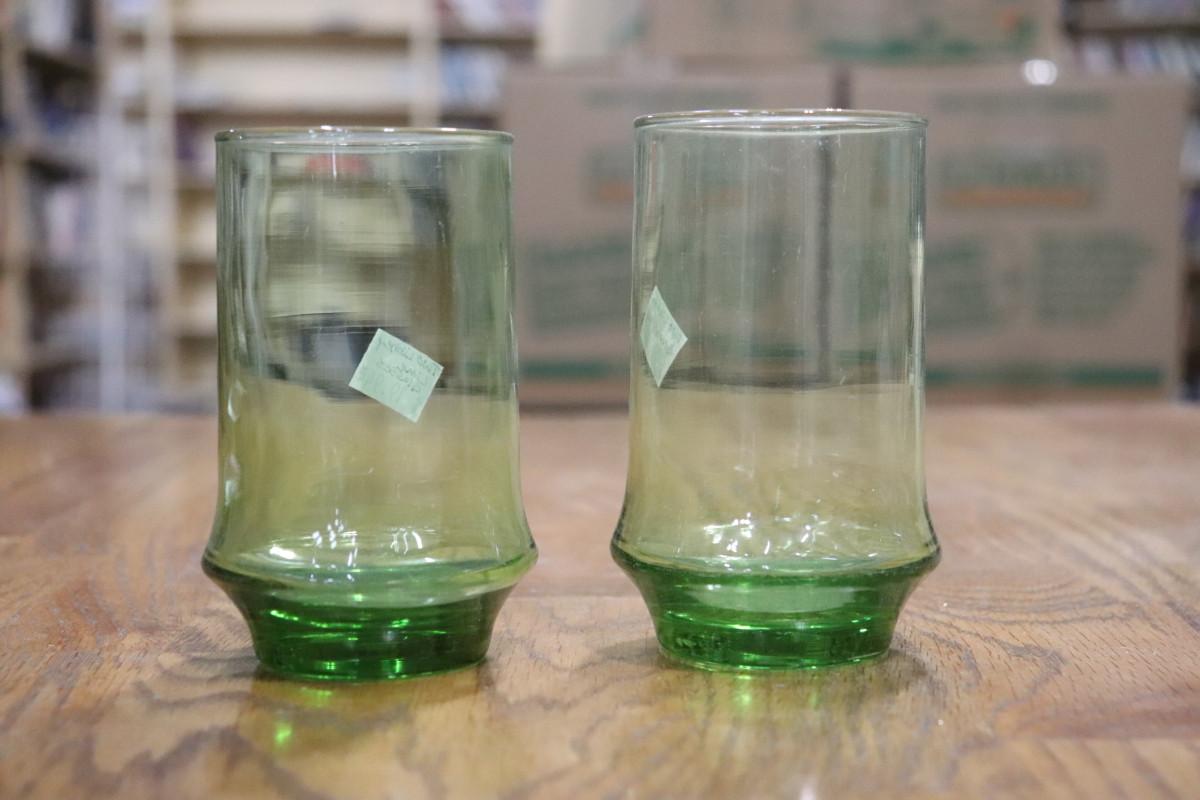 Pair of green colored glass | EstateSales.org