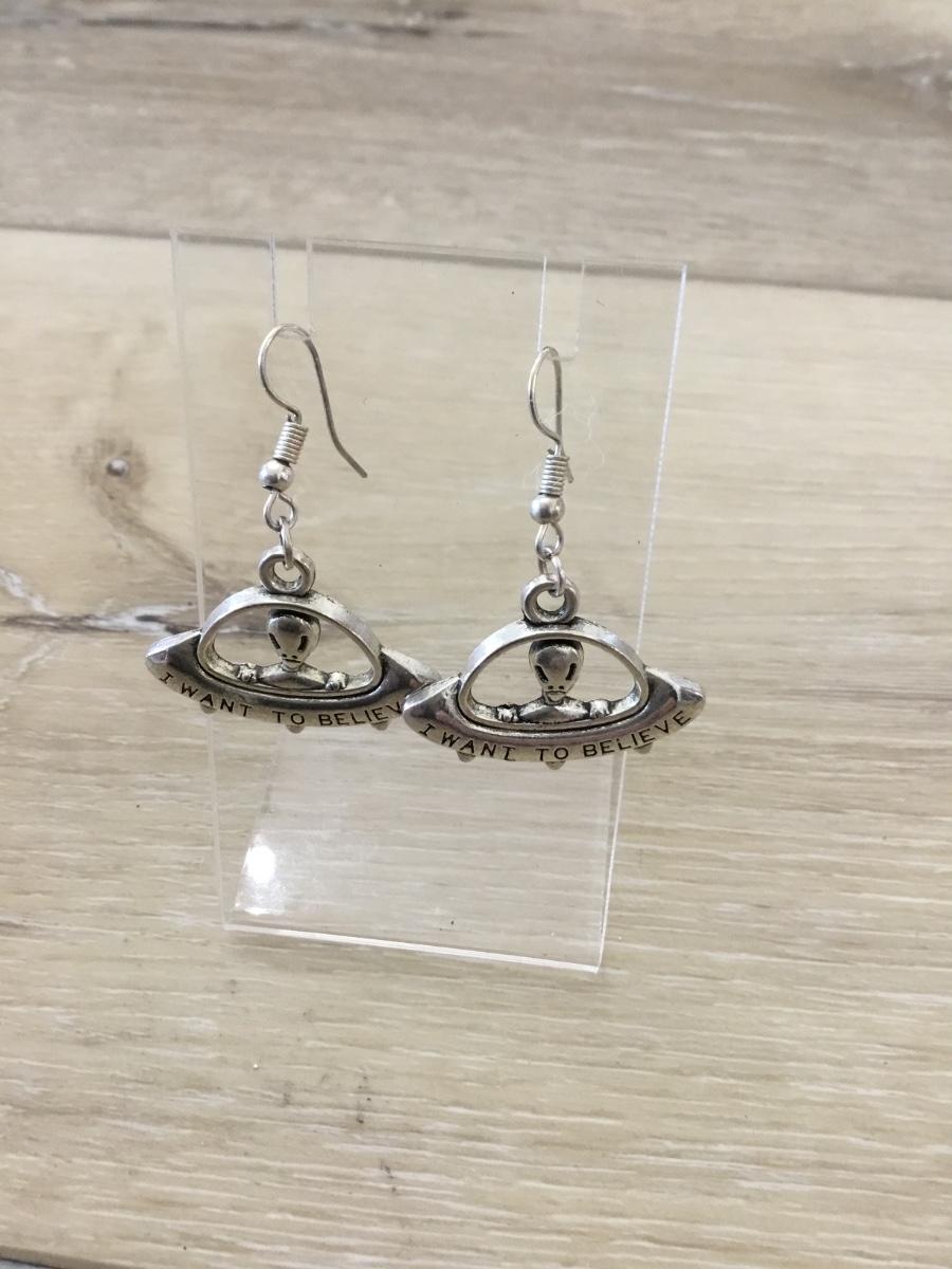 Silver tone alien earrings | EstateSales.org