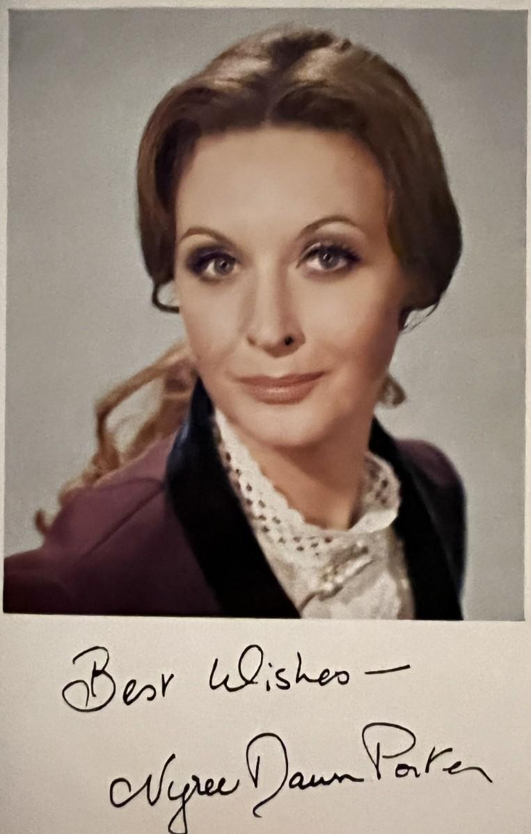 Nyree Dawn Porter facsimile signed photo. 3x5 inches | EstateSales.org