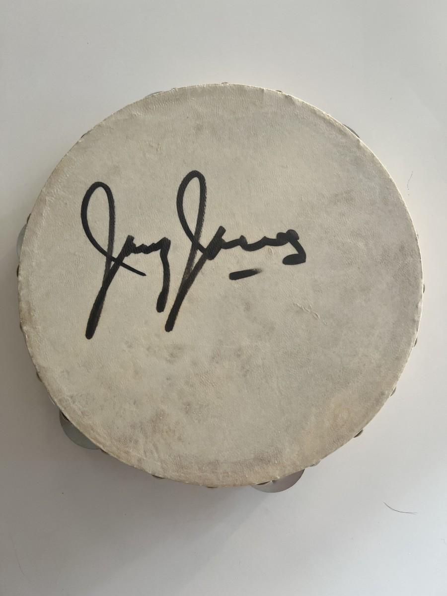 Jimmy Jones signed tambourine | EstateSales.org