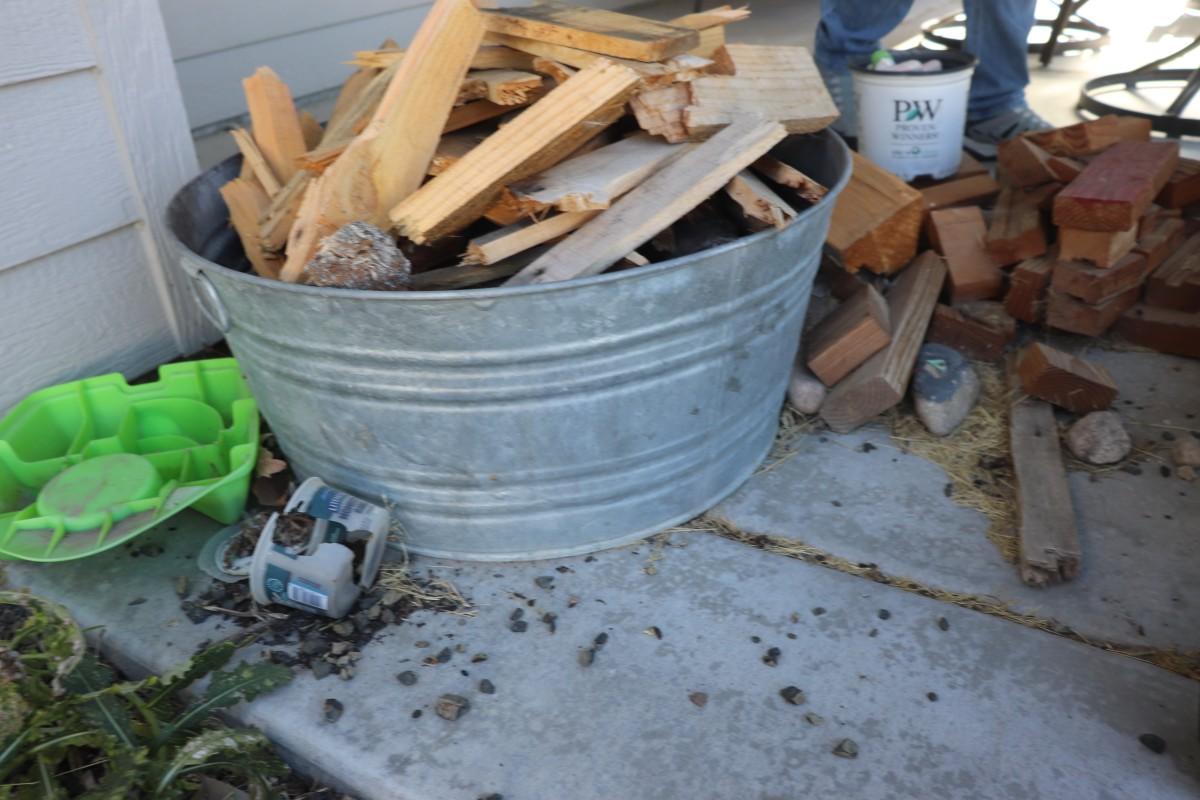 Pile of wood, and bucket | EstateSales.org