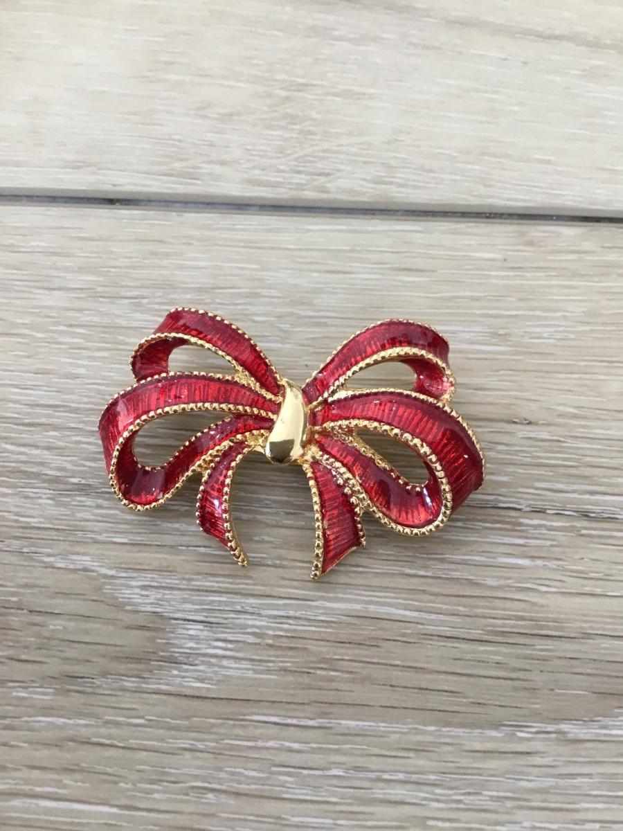 Gold tone vintage red bow brooch | EstateSales.org