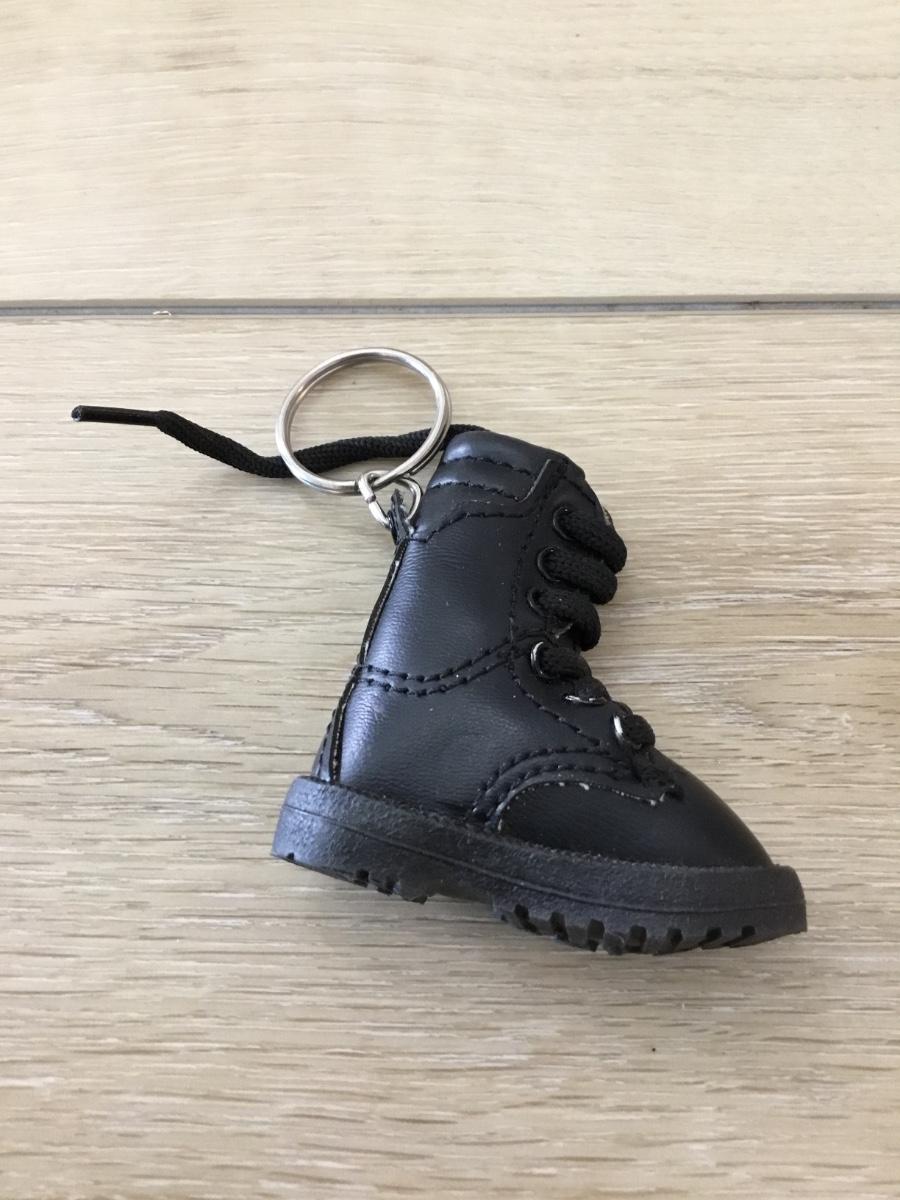 Black boot keychain | EstateSales.org