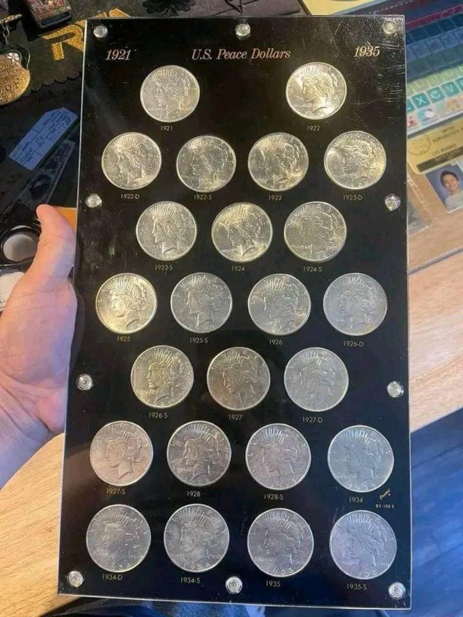 Encased Silver Peace Dollar set 1921 thru 1935 | EstateSales.org