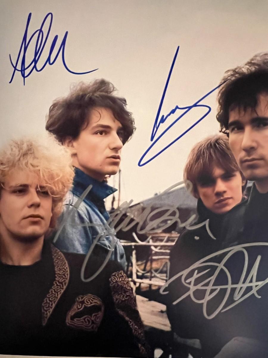 U2 band signed photo | EstateSales.org