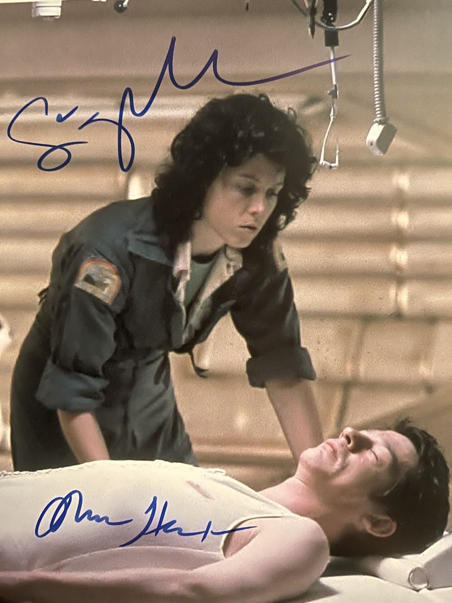 Aliens cast signed photo | EstateSales.org