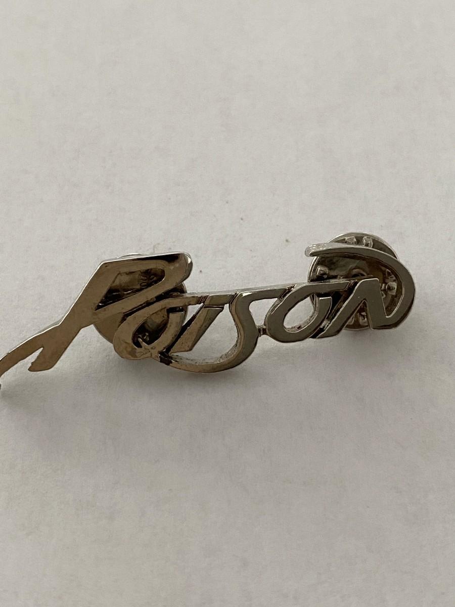 Poison vintage pin | EstateSales.org