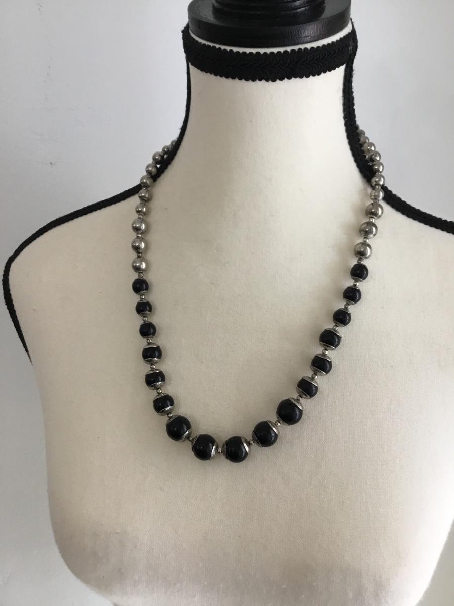 Silver tone LC marked beaded necklace | EstateSales.org