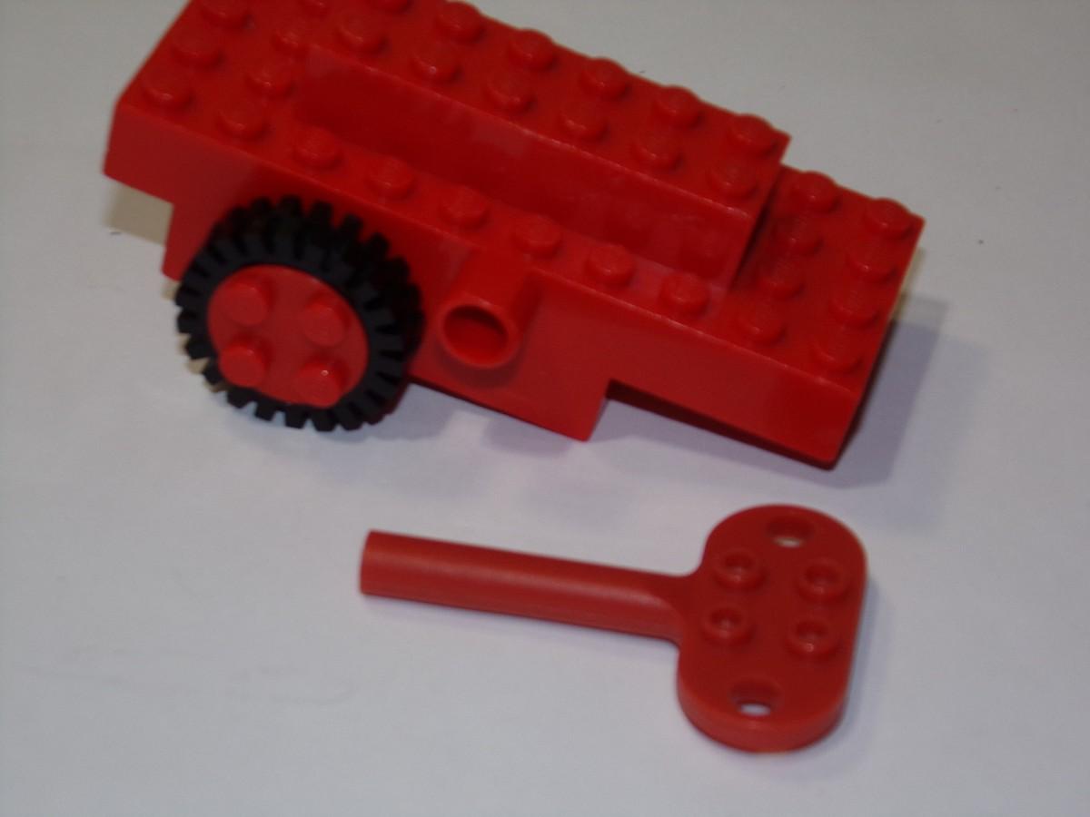 LEGO (1of3) motorized wind-up drive unit w/key | EstateSales.org