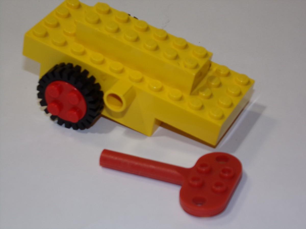 LEGO (2of3) motorized wind-up drive unit w/key | EstateSales.org