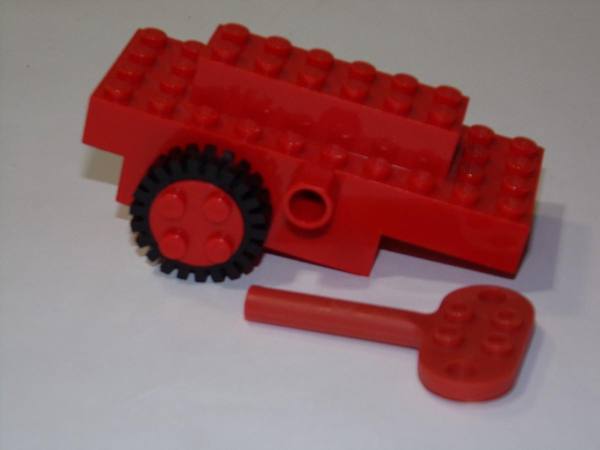 LEGO (3of3) motorized wind-up drive unit w/key | EstateSales.org