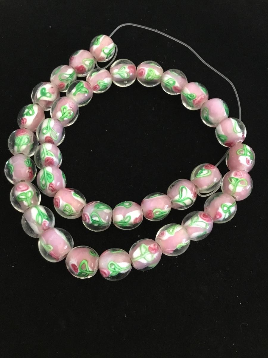 Long strand of roses glass beads | EstateSales.org