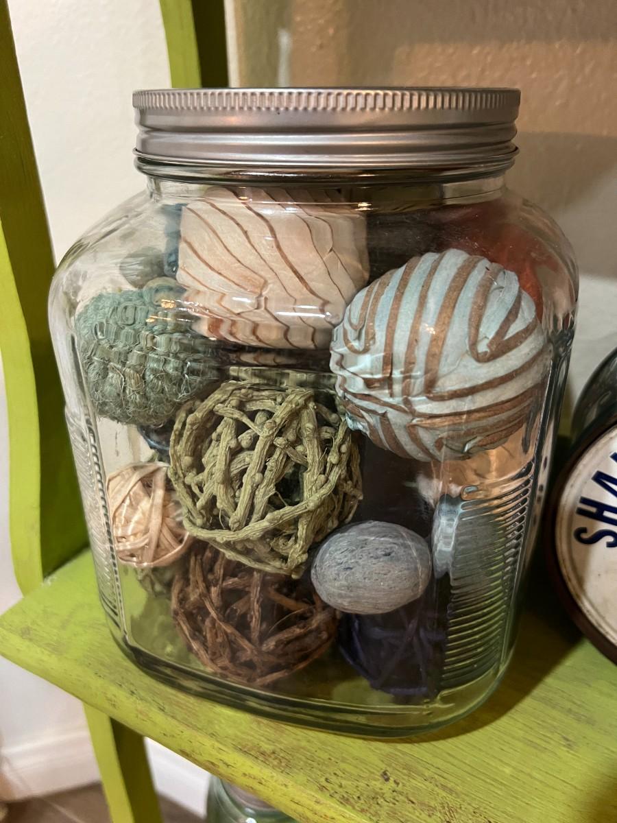 Vintage Jar with Colored Balls | EstateSales.org