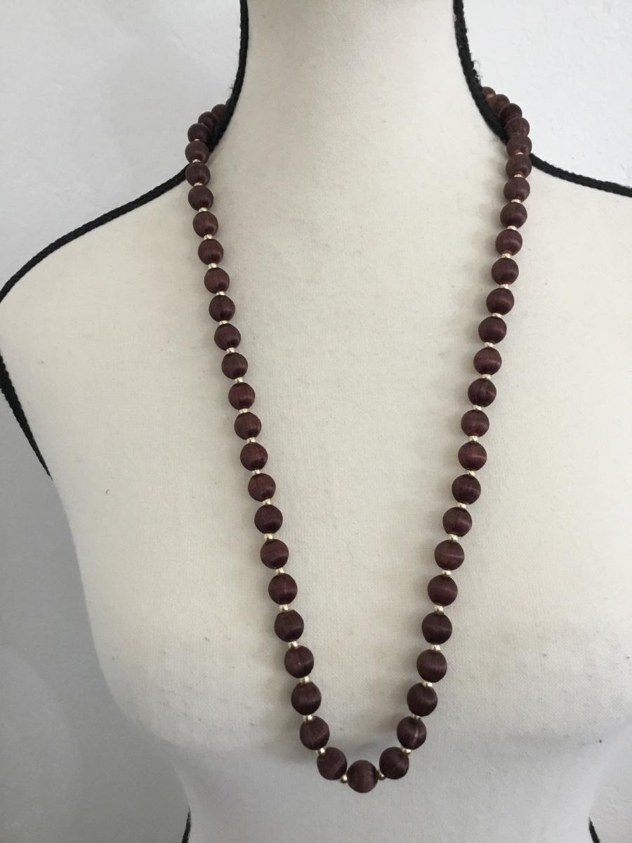 Brown string beaded gold tone spacer’s necklace | EstateSales.org