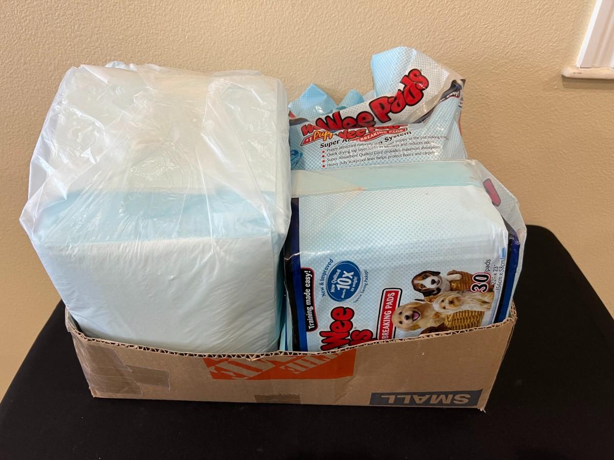 Box of pee pee pads | EstateSales.org
