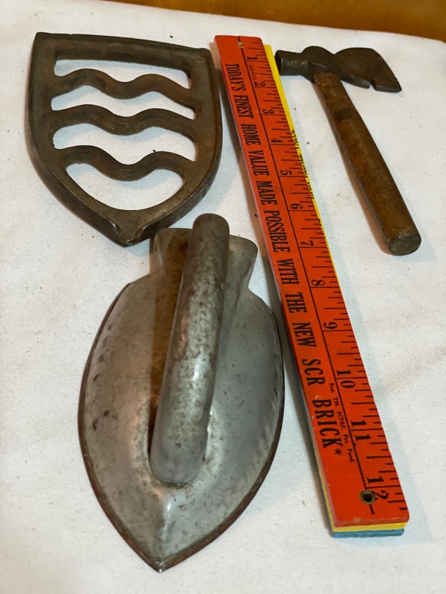 Toy iron and axe with iron rest plate | EstateSales.org