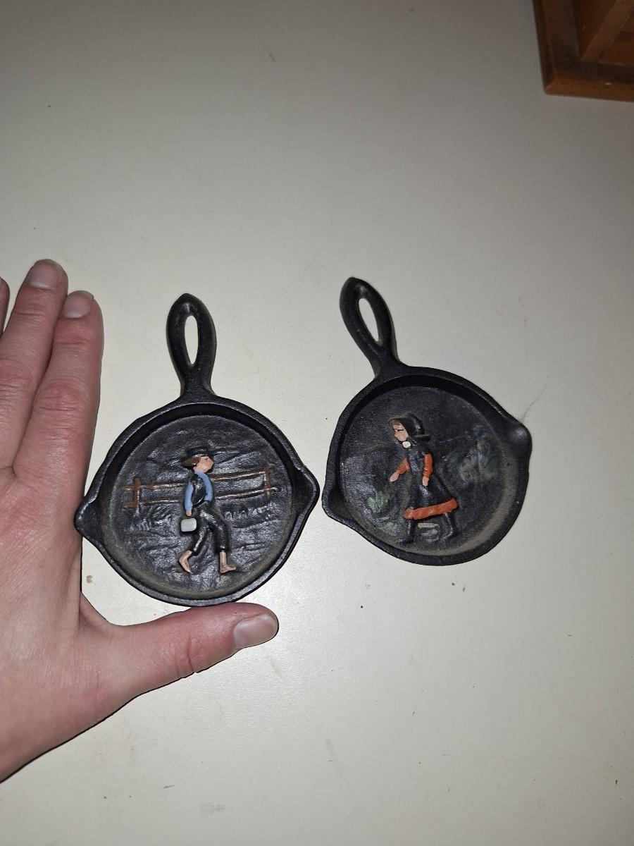 2 small decor cast iron pans | EstateSales.org