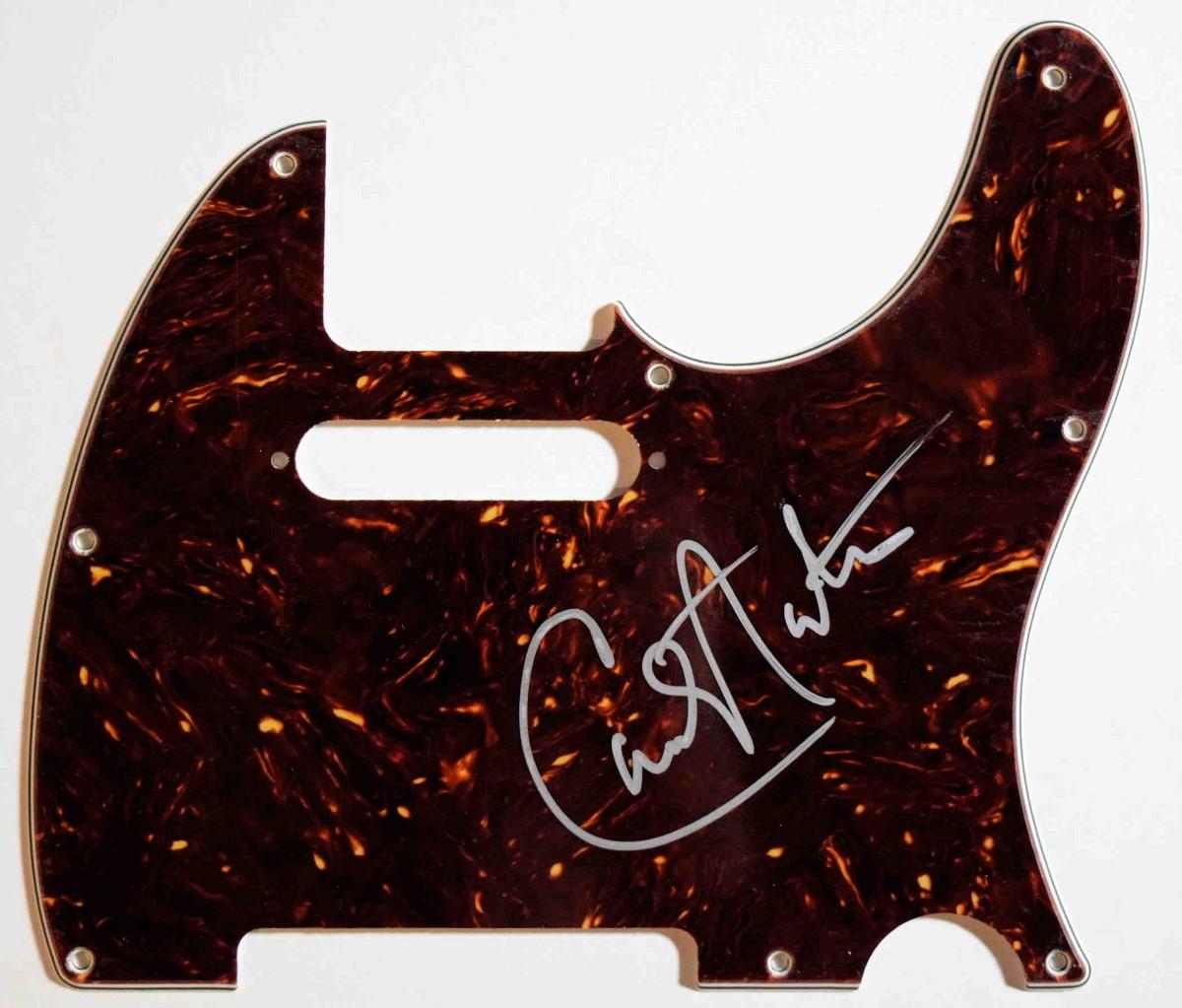 Carlos Santana signed pickguard | EstateSales.org