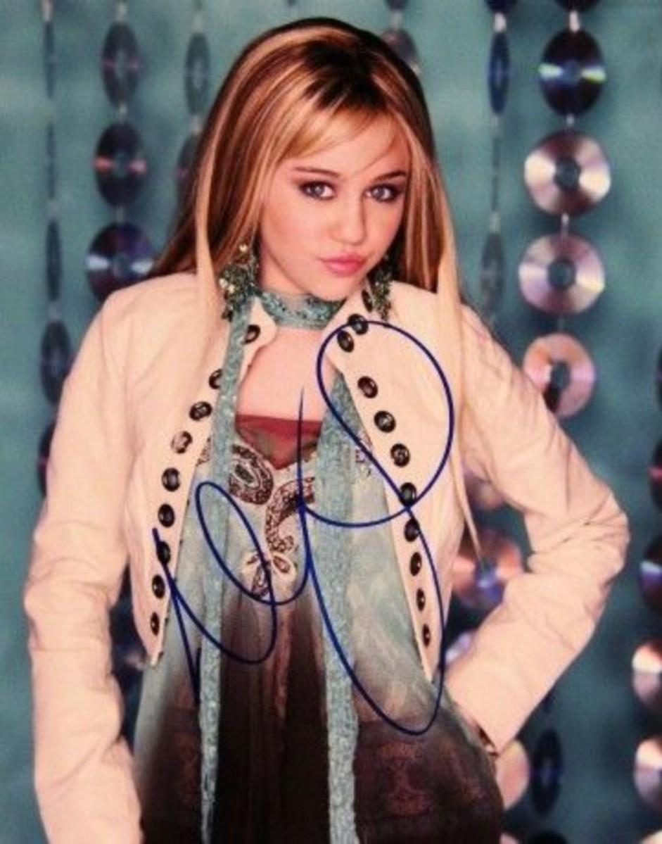 Miley Cyrus signed promo photo | EstateSales.org