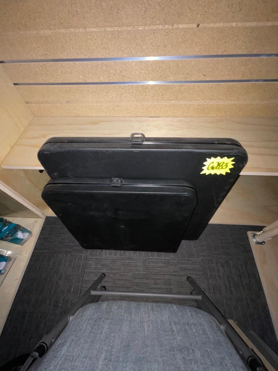 G283-2 black plastic pop-up tables | EstateSales.org