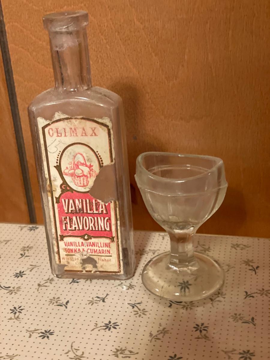 Vanilla bottle with eye wash cup | EstateSales.org