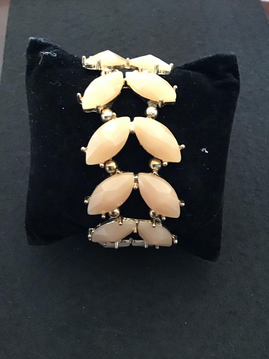 Gold tone stretch, peach bracelet | EstateSales.org