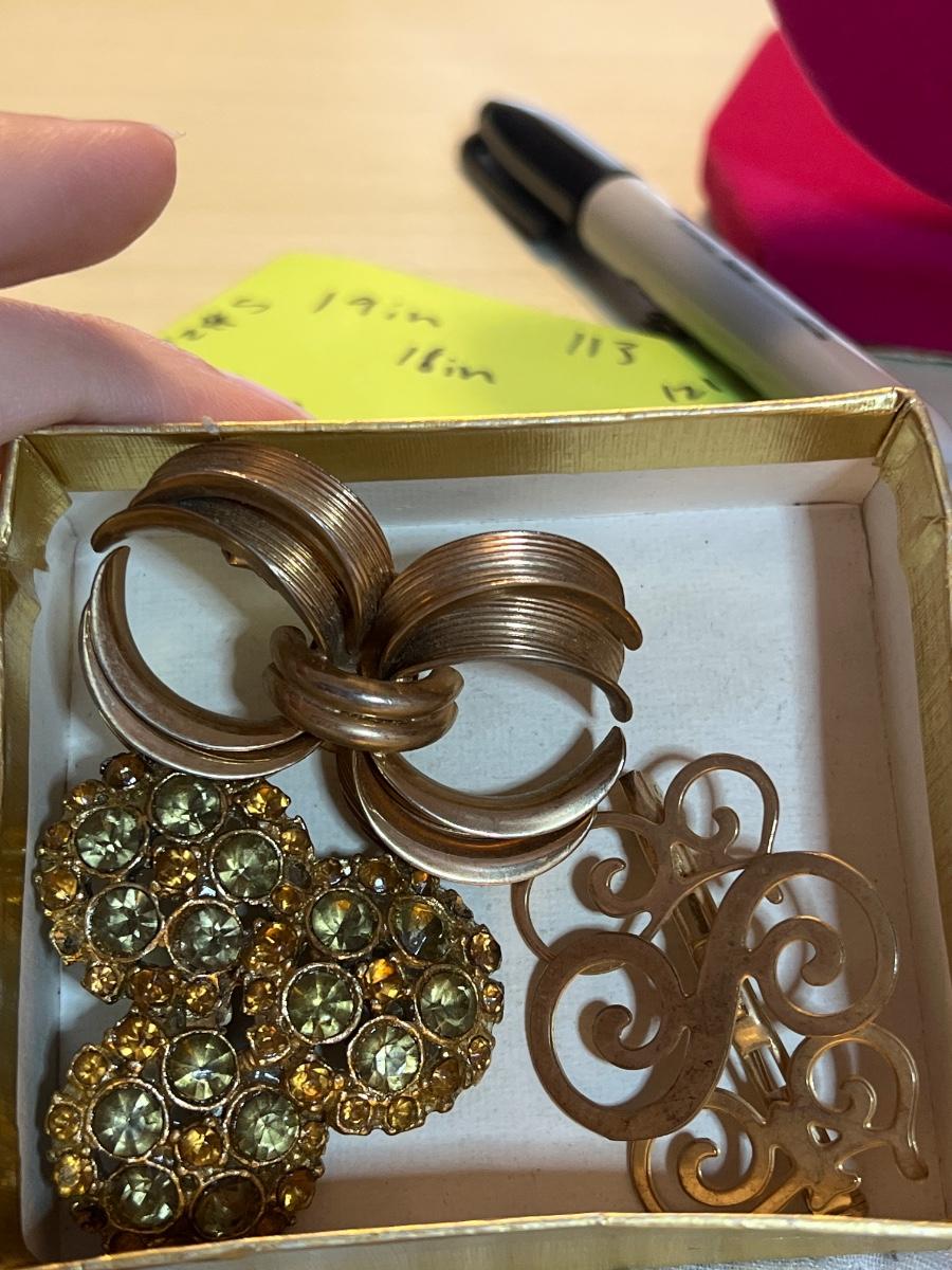 Golden toned pins | EstateSales.org