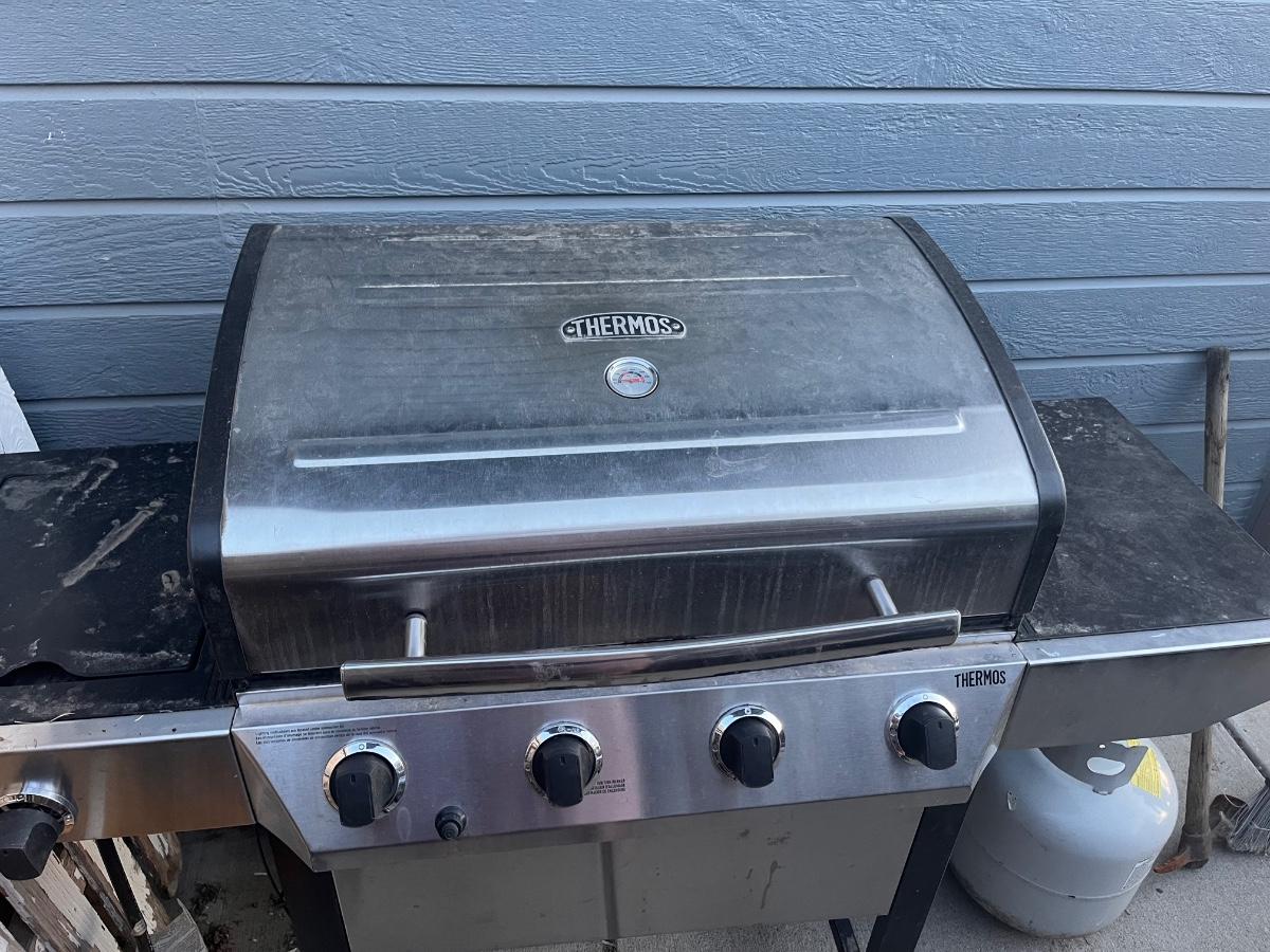 Thermos 4 burner propane grill | EstateSales.org