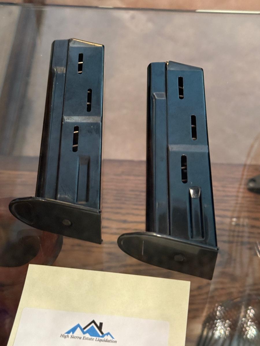 Pair of black high capacity magazines - unknown mfg. | EstateSales.org