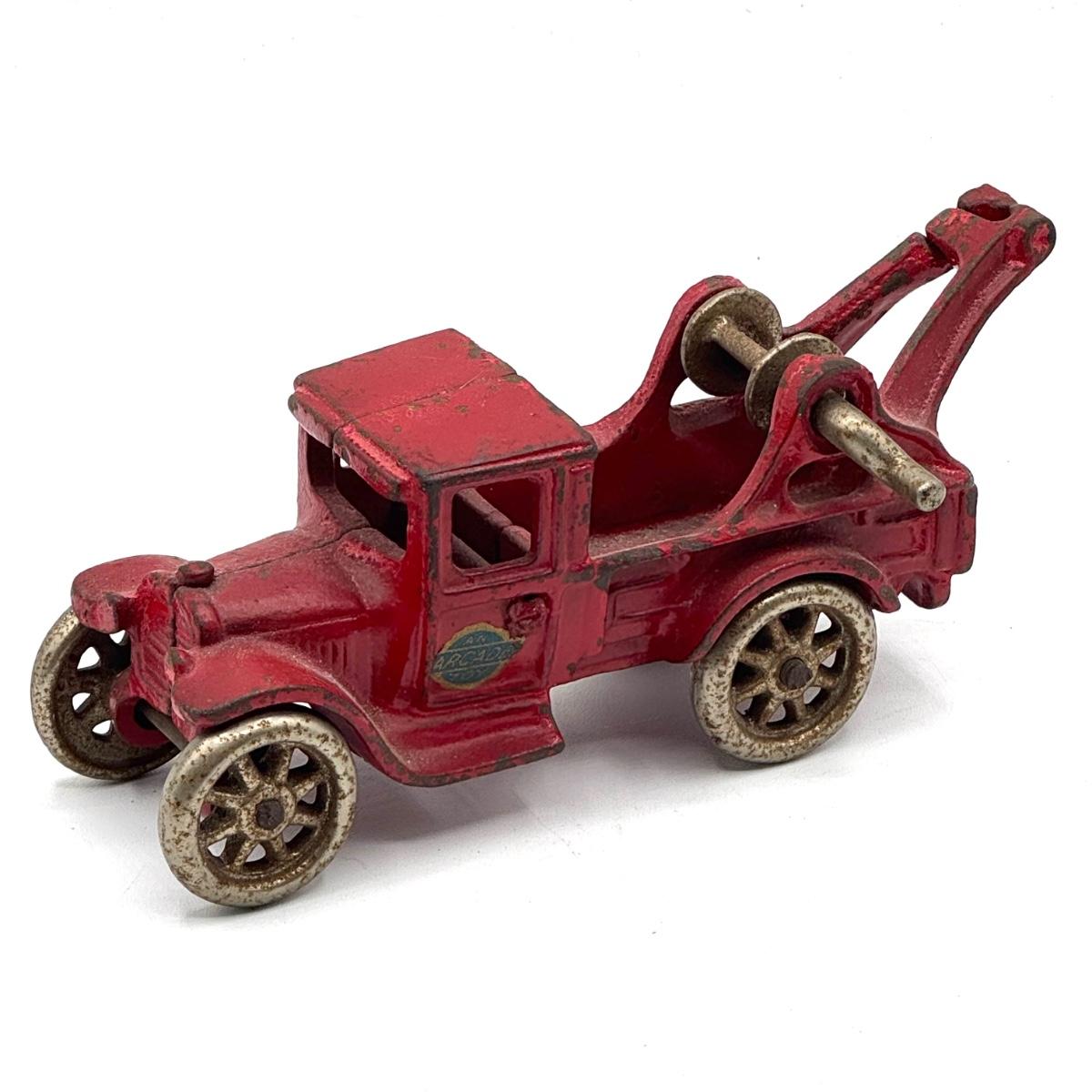 LOT 29: Antique Arcade Cast Iron Tow Truck | EstateSales.org