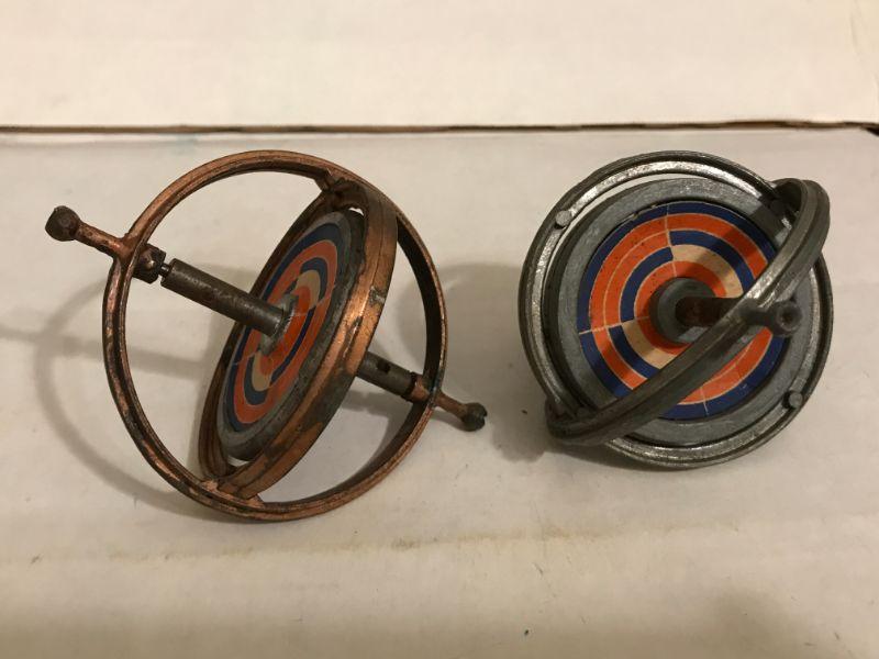 Set of 2 Vintage Metal Spinning Metal Top Toys | EstateSales.org