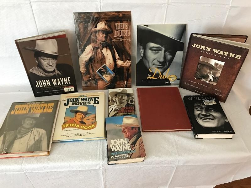 Lot #534 John Wayne Books and Tin Sign | EstateSales.org